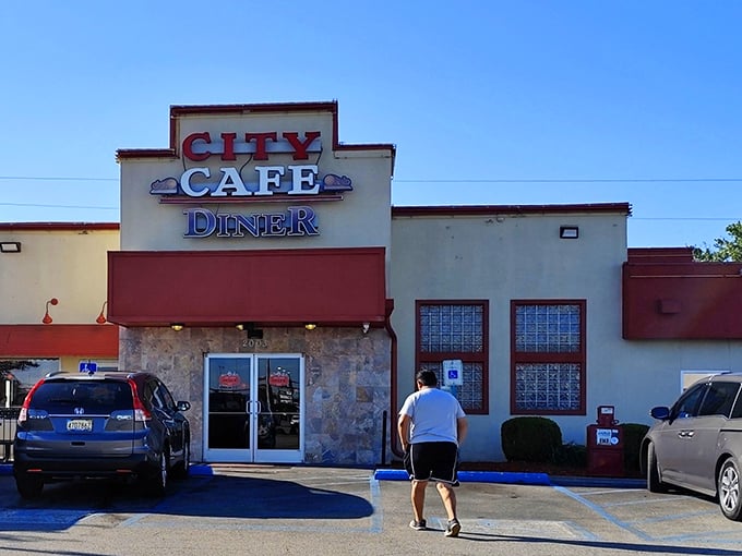 The neon "OPEN" sign at City Cafe Diner isn't just an invitation—it's a beacon for breakfast lovers seeking refuge from sad cereal.
