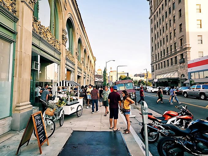 Downtown Fresno's bustling sidewalks offer a glimpse into affordable California living, where local shops welcome visitors without coastal price tags.