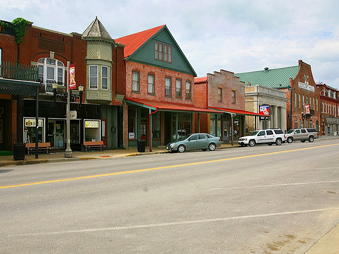 These colorful storefronts in Hermann aren't just pretty facades—they're community gathering spots where everyone knows your coffee order.