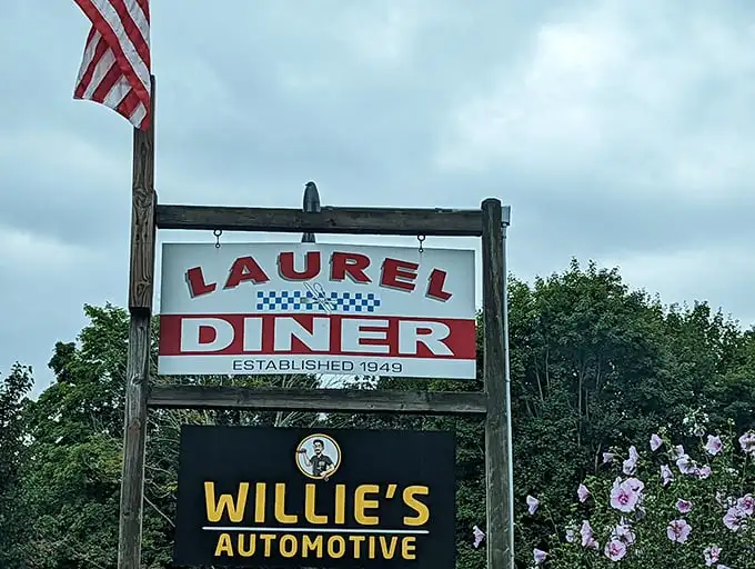 Morning sunshine and American flags frame the Laurel Diner sign – where pancakes are practically a patriotic duty.