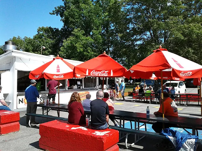 Those red Coca-Cola umbrellas aren't just for show—they're beacons of hope for Connecticut locals who know summer officially begins when Harry's picnic tables appear.