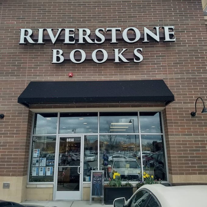 Books and brick—a perfect pairing. Riverstone's welcoming entrance promises literary adventures waiting just beyond those glass doors.