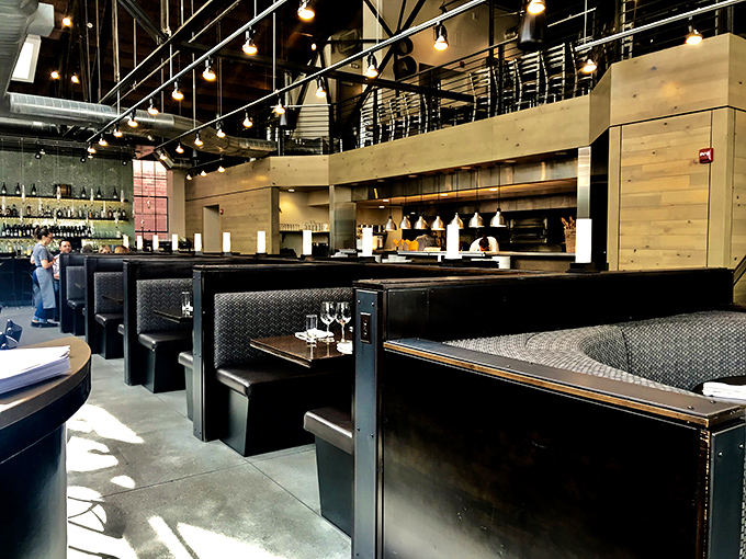 Industrial chic meets maritime comfort in this thoughtfully designed space. Those leather booths aren't just stylish—they're perfect for leaning in to discuss your oyster epiphanies.