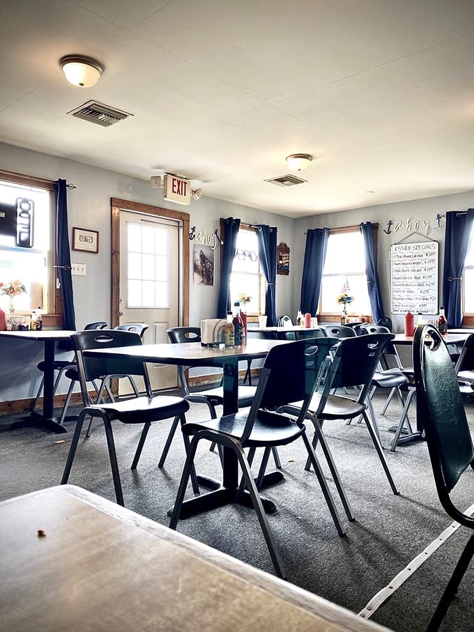 Simple tables, navy curtains, and natural light create the perfect stage for seafood stardom. No distractions from what matters most—the food.