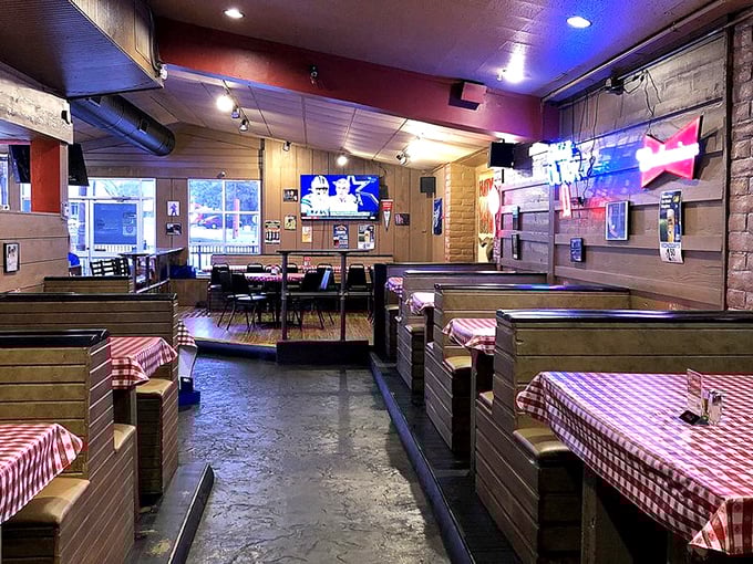 Wooden booths, red-checkered tablecloths, and the promise of meat-induced euphoria. This isn't just a restaurant—it's a barbecue sanctuary where calories don't count.