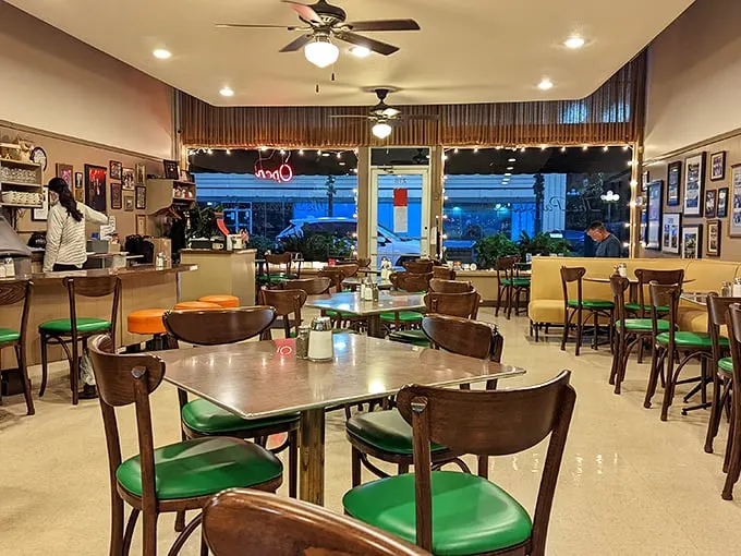 Inside, wooden chairs with bright green seats create that perfect nostalgic diner atmosphere—where breakfast dreams come true and calories don't count until tomorrow.