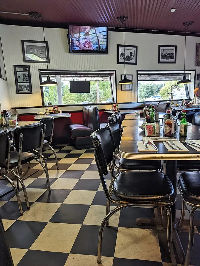 That classic black and white checkered floor isn't trying to be retro-cool—it's the real deal that's witnessed countless coffee refills.