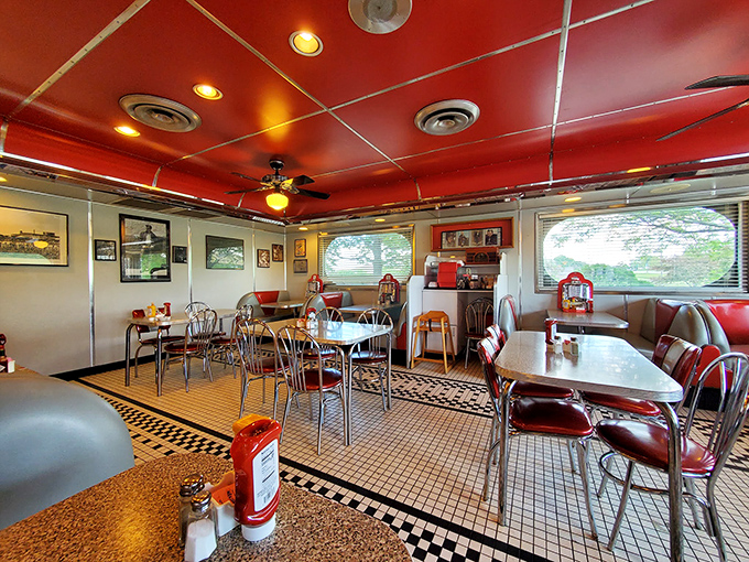 Red vinyl booths and checkered floors create the perfect stage for Iowa's legendary dining experience. 