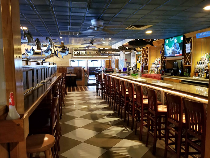 Nautical meets approachable at the bar where conversations flow as freely as the drinks. Fish sculptures overhead remind you what's on the menu.