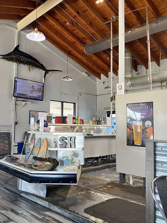 Rustic wooden beams and nautical decor create the perfect backdrop for seafood feasting. That marlin on the wall isn't just decoration—it's quality control supervision.