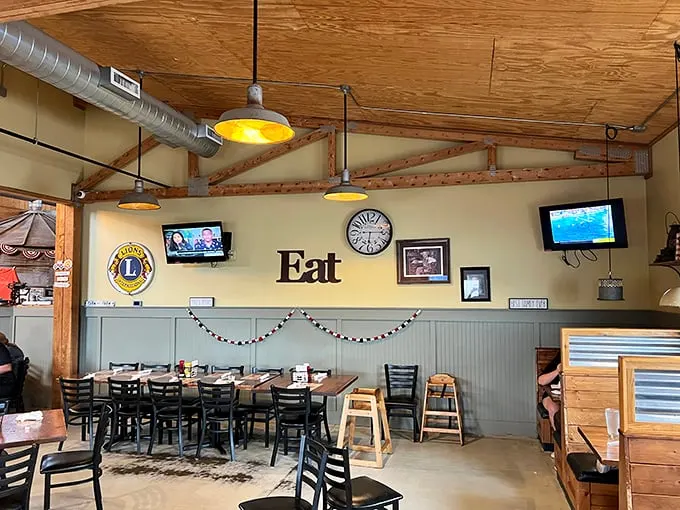 Simple wooden beams, exposed ductwork, and that straightforward "Eat" sign tell you everything you need to know. This place isn't trying to impress you with decor—they're saving that energy for the food.