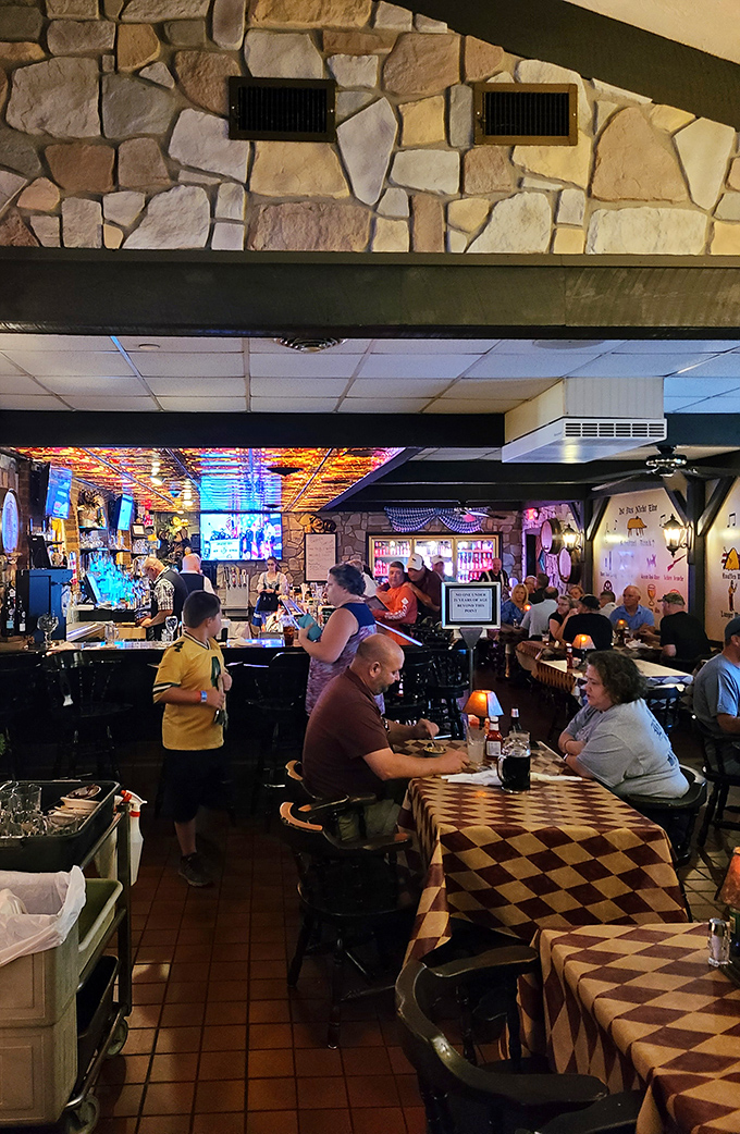 Inside, the warm glow of Schnitzelbank's dining room invites you to settle in. Those checkered tablecloths aren't just decoration—they're landing pads for incoming German feasts.