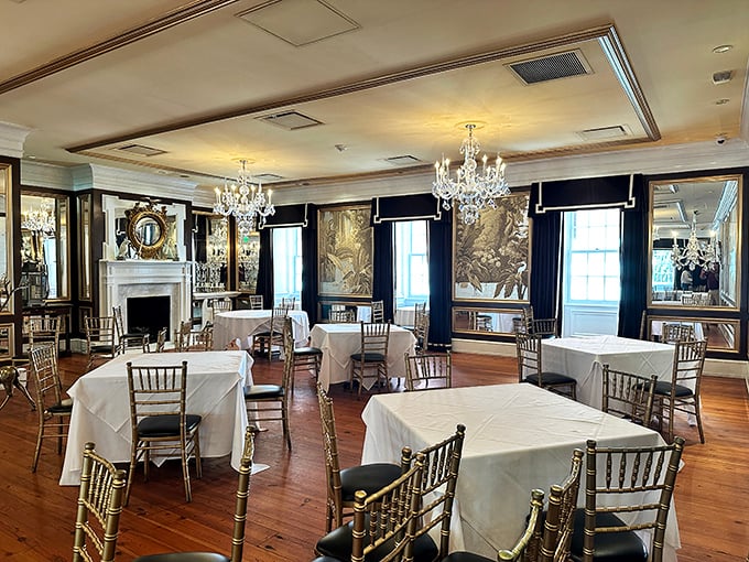 Crystal chandeliers illuminate white-clothed tables while colonial portraits watch over your meal—they've seen centuries of diners and probably some spilled wine too.