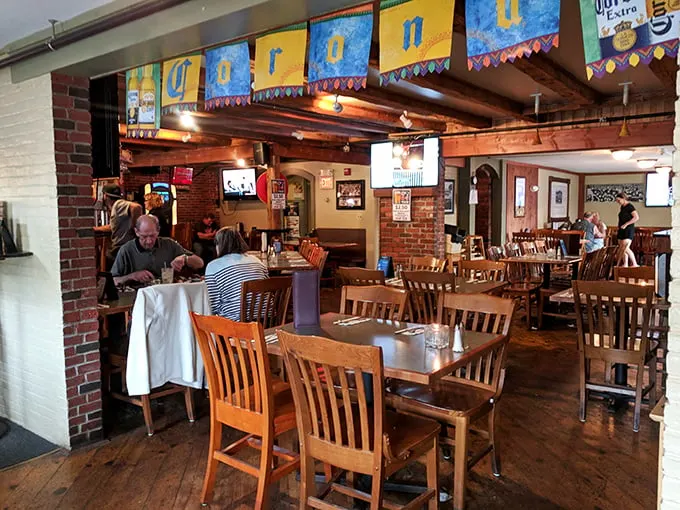 Exposed brick walls and wooden beams create that "Nonna's dining room" vibe where memories are made between bites of perfect pasta.