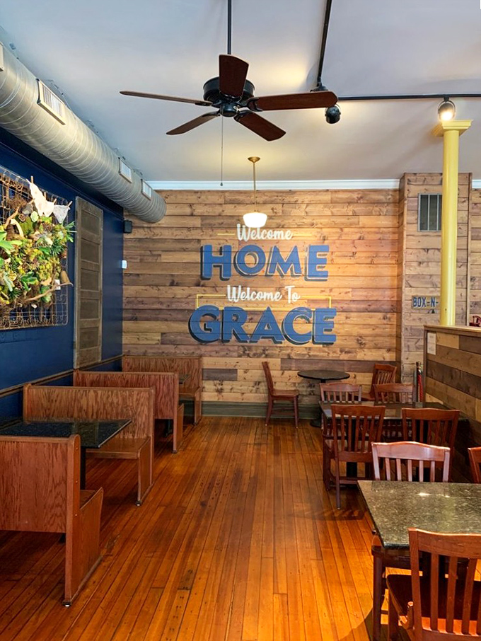 "Welcome HOME, Welcome to GRACE" isn't just wall decor—it's the restaurant's mission statement written in warm wood and cool blue.