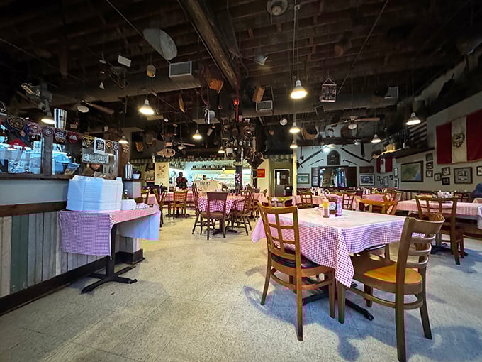 Step inside and look up—the ceiling's quirky collection of antique farm tools, kitchen implements, and memorabilia tells you this isn't your average chain restaurant experience.