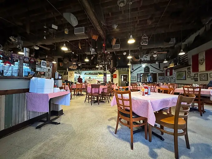 Step inside and look up—the ceiling's quirky collection of antique farm tools, kitchen implements, and memorabilia tells you this isn't your average chain restaurant experience.