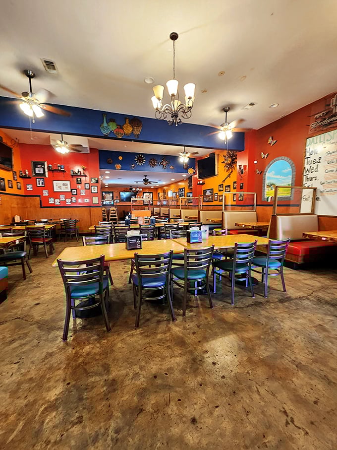 Step inside and you're greeted by vibrant orange and blue walls adorned with memorabilia – the universal language of "you're about to eat well." 