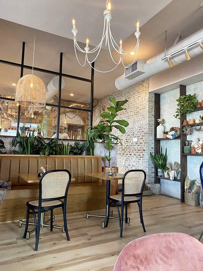 Exposed brick meets lush greenery under elegant lighting—whoever said breakfast can't be sophisticated clearly never visited this botanical-chic paradise.