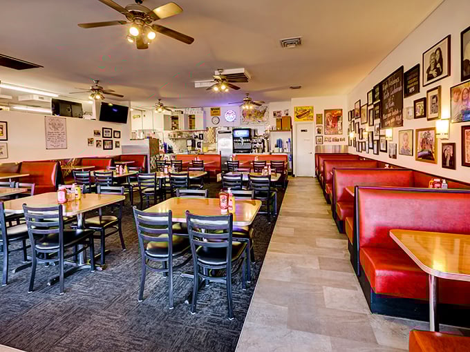 Red vinyl booths and walls covered in memories – stepping into The Bagel Deli feels like being welcomed into a family album where every photo comes with a side of comfort.