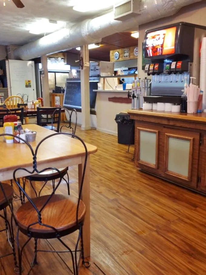 Simple wooden tables, practical chairs, and that soda fountain – this isn't interior design, it's a time machine to when restaurants prioritized food over Instagram.