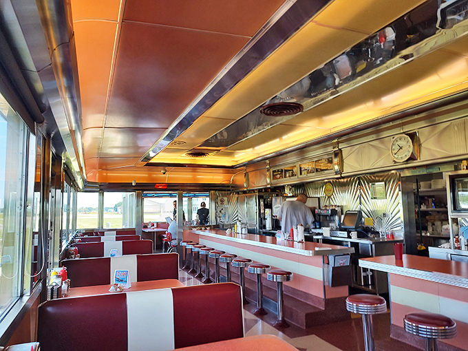 Step inside and time travel begins. The gleaming chrome, vibrant red booths, and classic counter stools transport you to the golden age of American diners.