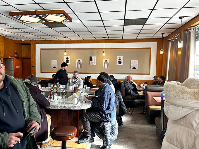 Where neighborhood stories unfold daily—Little Corner's dining room blends simplicity with warmth, like your favorite aunt's living room but with better coffee.