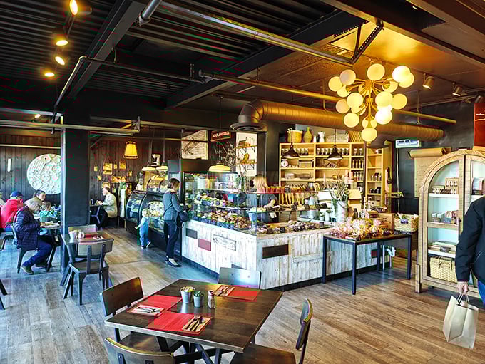 Inside, rustic meets refined with wooden accents, industrial touches, and a pastry display that will make your willpower wave the white flag of surrender.