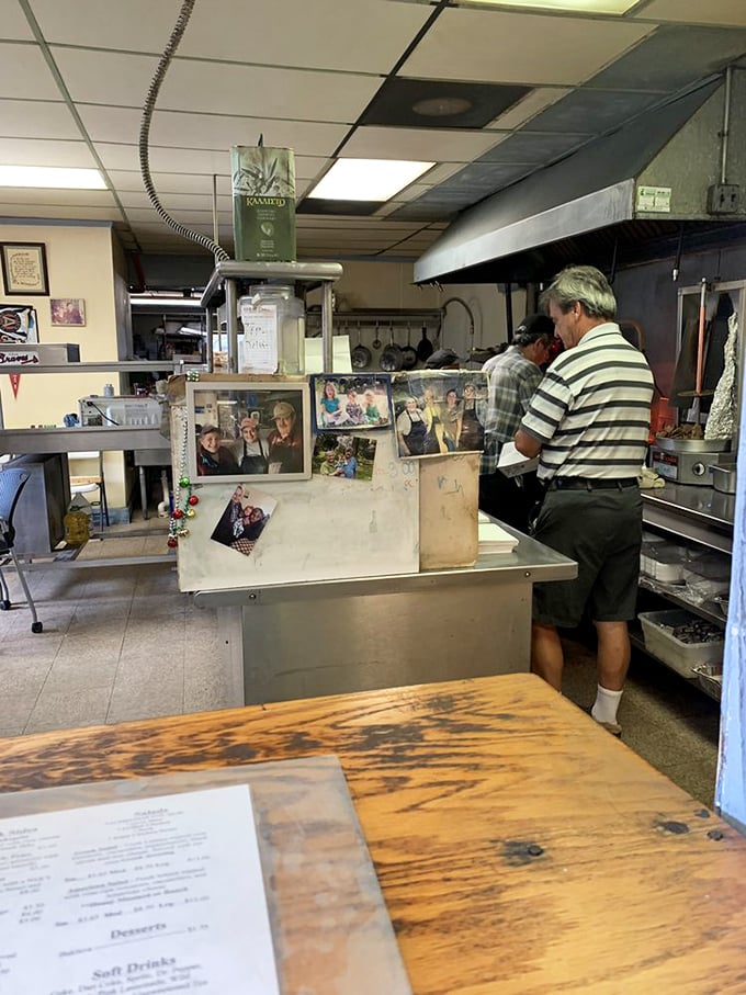 Behind the counter, culinary magic happens with methodical precision. Family photos tell the story that the menu can't—this place is built on tradition, not trends.