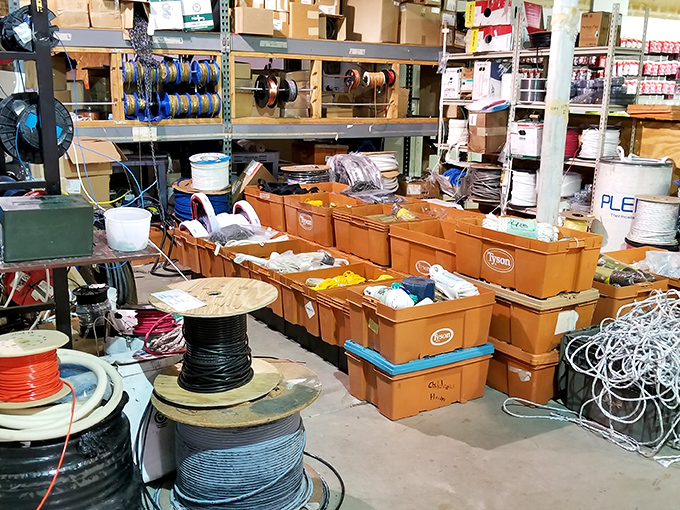 Spools of wire and bins of miscellaneous parts create a hardware wonderland. Like a treasure hunt where X marks the spot on every aisle.