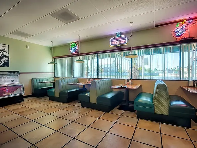 Classic seafoam green booths and neon beer signs create the perfect time capsule where calories don't count and coffee refills are practically mandatory.