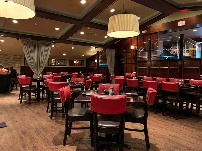 Red chairs await at Harry's, where the dining room strikes that perfect balance between "special occasion" and "Tuesday night splurge."