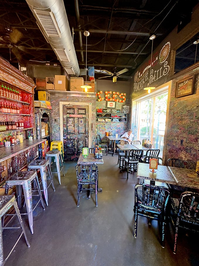 Graffiti-covered walls tell the stories of thousands of satisfied diners—a living guestbook where every scribble represents a happy meal.