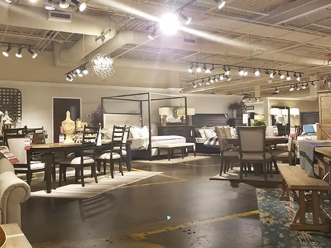 Chandeliers casting warm light over carefully curated displays. It's like walking through someone's dream home, except everything's for sale.