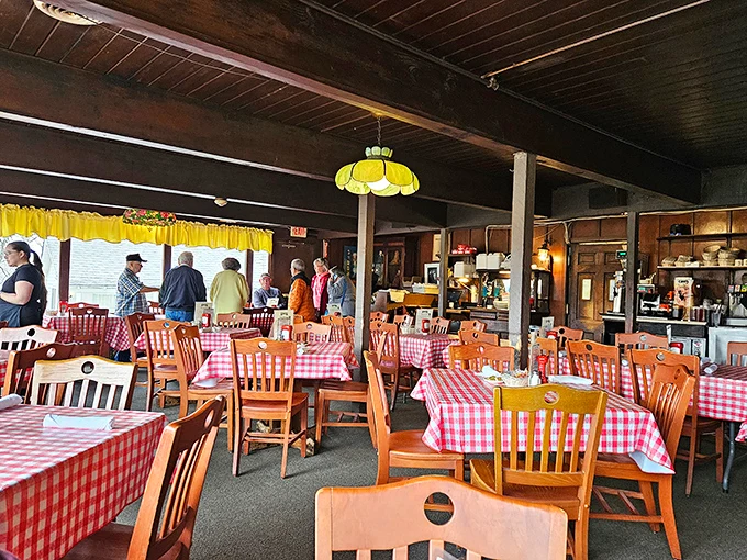 Red and white checkered tablecloths set the stage for culinary nostalgia, where conversations flow as freely as the gravy in this no-pretense dining room.