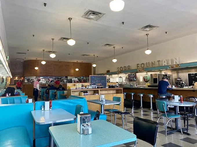 Mid-century magic lives in these turquoise booths and checkerboard floors, where conversations flow as smoothly as the coffee refills.