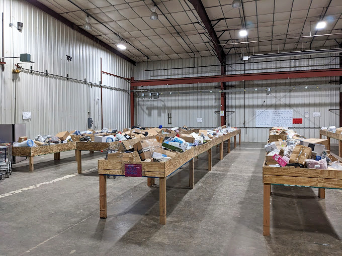 The thrill of the hunt in full display. Each wooden table represents a different expedition into the unknown world of retail surprises.