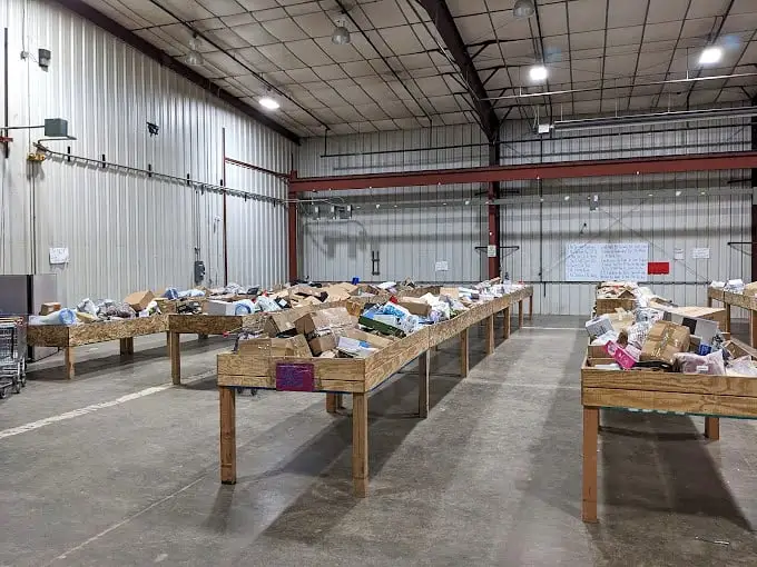 The thrill of the hunt in full display. Each wooden table represents a different expedition into the unknown world of retail surprises.