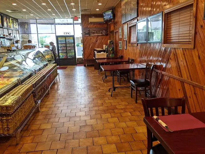 Wood paneling that's seen more sandwich debates than a marriage counselor – classic deli interiors never go out of style.