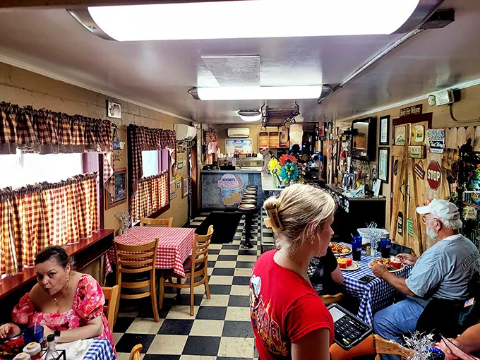 Inside, the checkered floor and red gingham tablecloths aren't trying to impress anyone—they're just setting the stage for the real star: that glorious barbecue waiting to grace your plate.