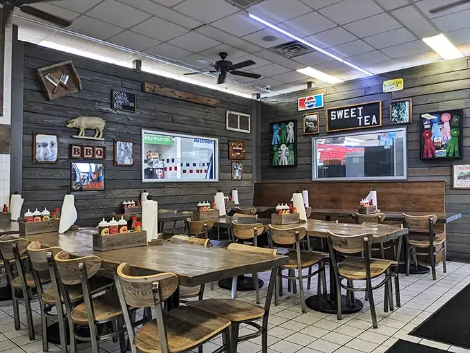 Rustic wood-paneled walls, simple tables, and BBQ memorabilia create an atmosphere where the food—not fancy décor—takes center stage.