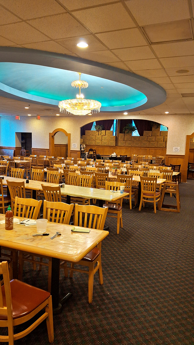 Beneath the blue-lit ceiling and chandelier, wooden tables await the impending plate parade. It's buffet dining with unexpected ambiance—like your aunt's dining room, but with unlimited crab legs. 