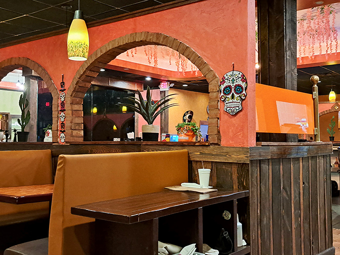 Those terracotta walls and brick archways aren't just decoration—they're a portal to a dining experience that feels wonderfully removed from Newark's everyday hustle.