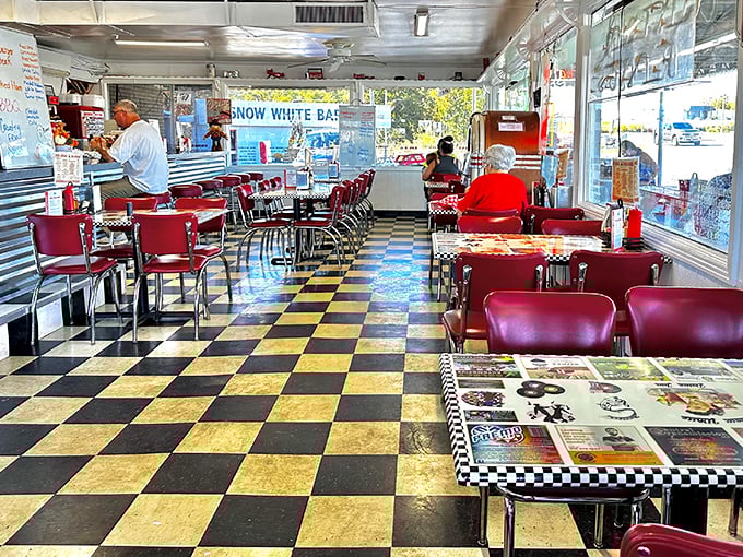 Classic Americana in every corner—black and white checkered floors, cherry-red vinyl booths, and conversations that have spanned generations.