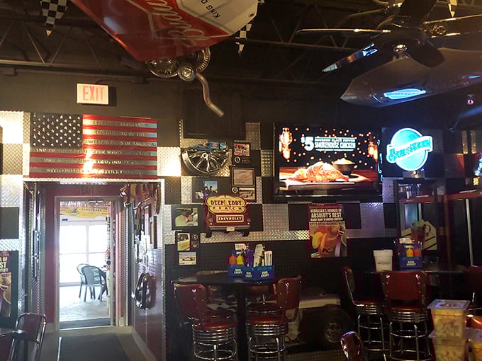 Step inside and the automotive-themed interior transports you to a world where classic cars and comfort food create the perfect pit stop for hungry travelers.