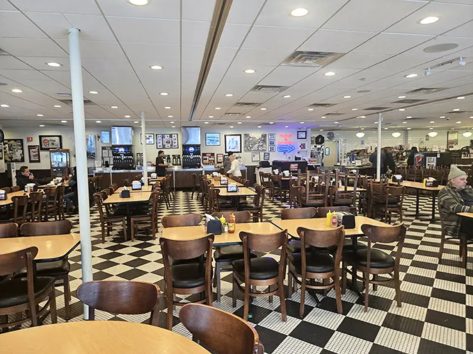The classic checkerboard floor and wooden chairs aren't trendy design choices—they're timeless witnesses to decades of Chicago history and countless satisfied appetites.