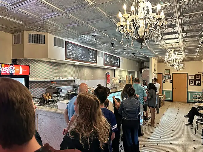 The line may be long, but under those elegant tin ceilings and chandeliers, waiting becomes part of the experience—like the anticipatory moments before a great concert.