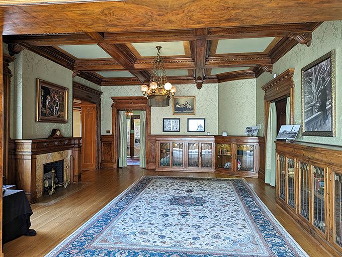 Stepping into the reception room feels like time-traveling to the Gilded Age. That ornate woodwork and period-perfect decor weren't ordered from a catalog—they're the real McCoy.