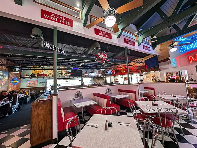 The checkerboard floors and cherry-red booths aren't trying to be retro—they're the real deal. This is America's highways distilled into dining room form.