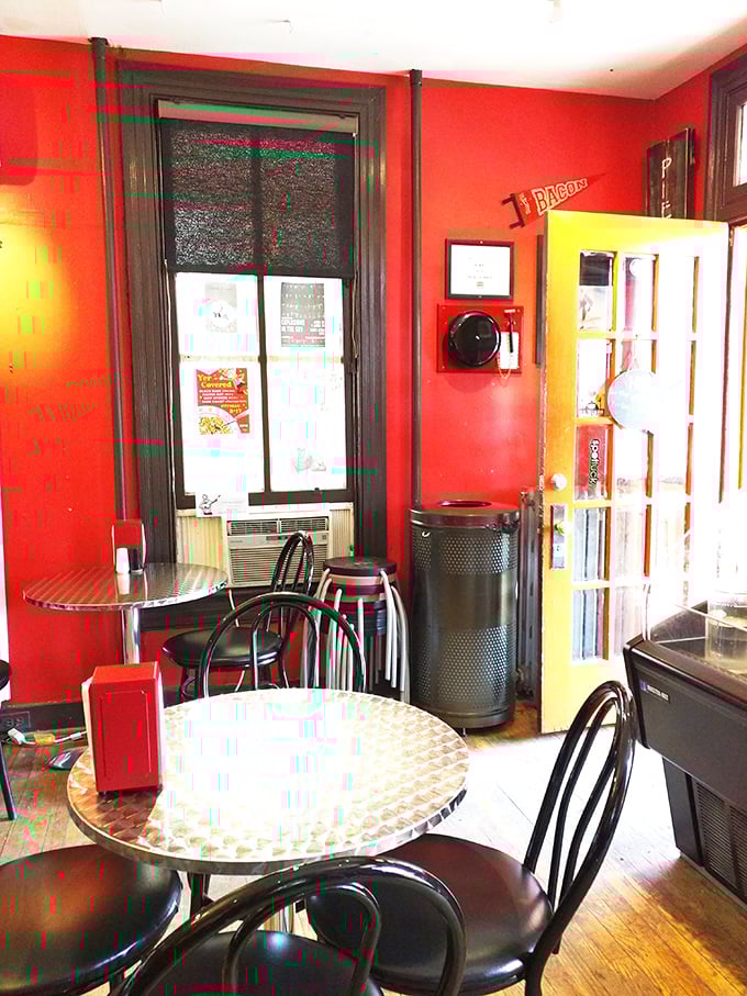 Red walls that pop like cherry filling against metal tables. The dining room feels like your coolest friend's kitchen—if that friend were a pie genius.
